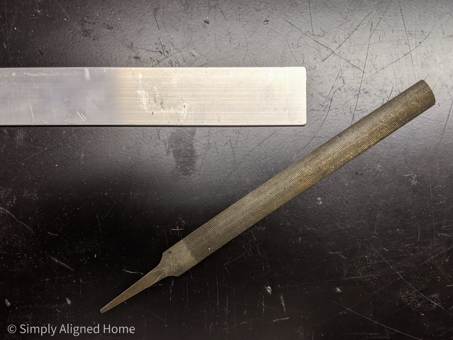 Smooth-sharp-edges-with-metal-file