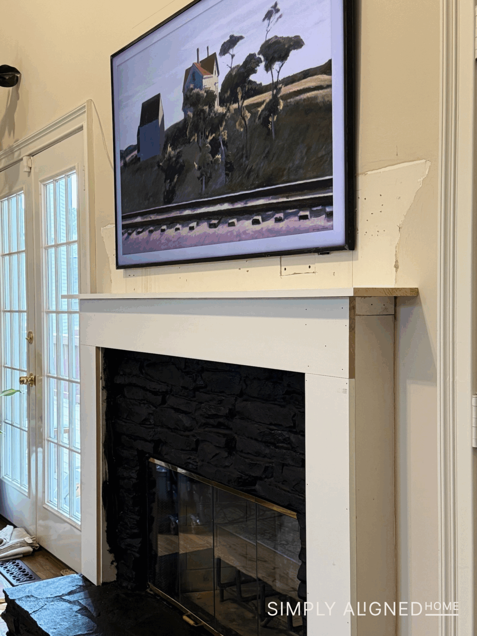How to Update a Fireplace Surround with Wood and Trim - Simply Aligned Home