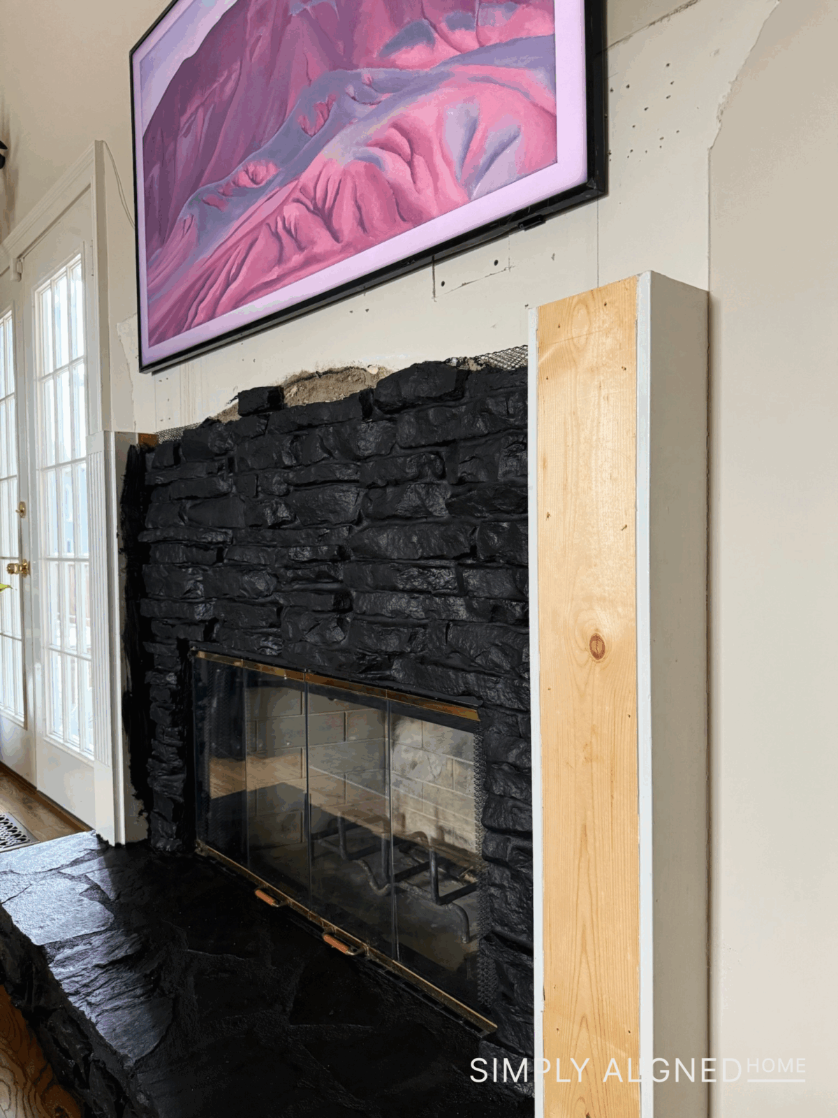 How to Update a Fireplace Surround with Wood and Trim - Simply Aligned Home